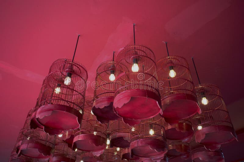 Light Idea Bulps in the Red Cages with Red Wall Background. Business ...