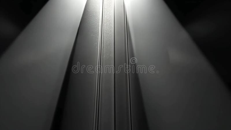 Light Illuminates the Narrow Gap between Closing Elevator Doors ...