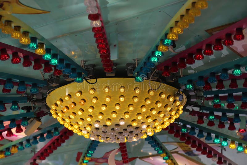 Illumination at Carousel Top. Star-shaped Lamp with Multi-colored Light ...