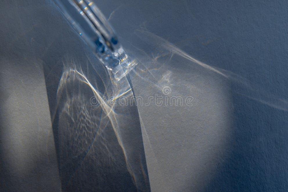 Refraction of Light Creates Abstract Patterns on a Gray Surface ...