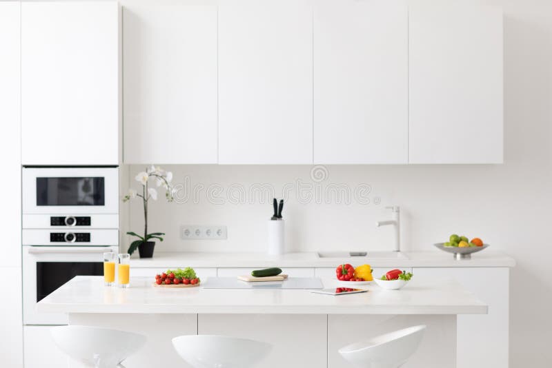 Light Kitchen Interior with Fresh Vegetables on the Table Stock Image ...