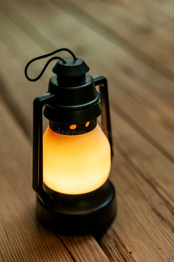 Light Lamp, Black Plastic on a Wood Table Editorial Photography - Image ...