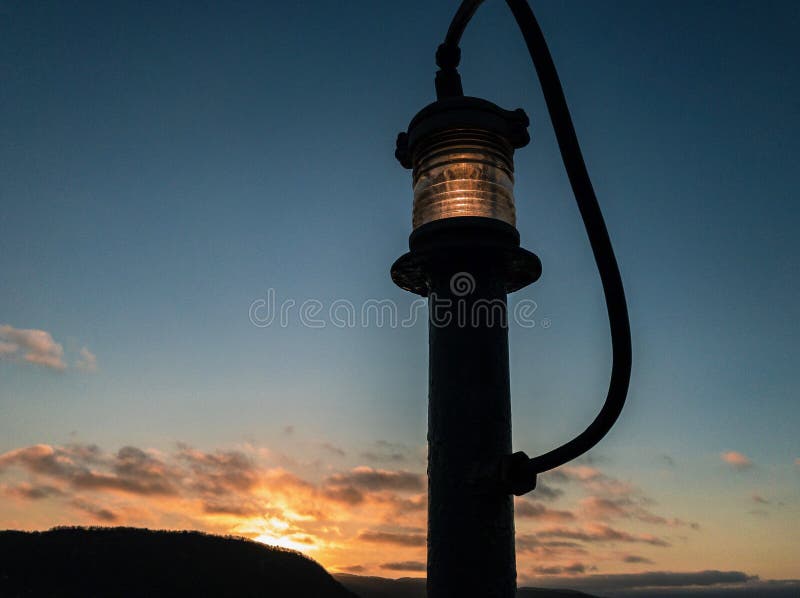 Light from a Lamp Post from the Rear Deck of a Ship Against the Sunset ...