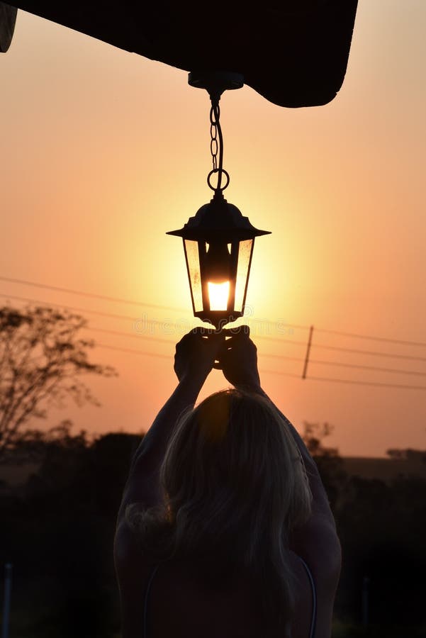 The Light of the Lantern or Actually the Sunset? Stock Photo - Image of ...