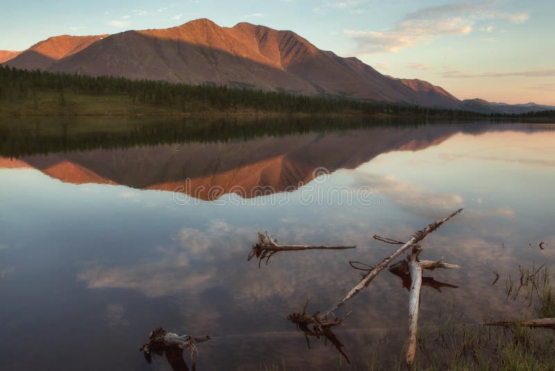 The Light of the Low Sun on the Top of the Mountain. Stock Photo ...