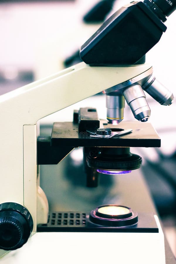A Light Microscope with Knobs and Screws with Light on Stock Image ...