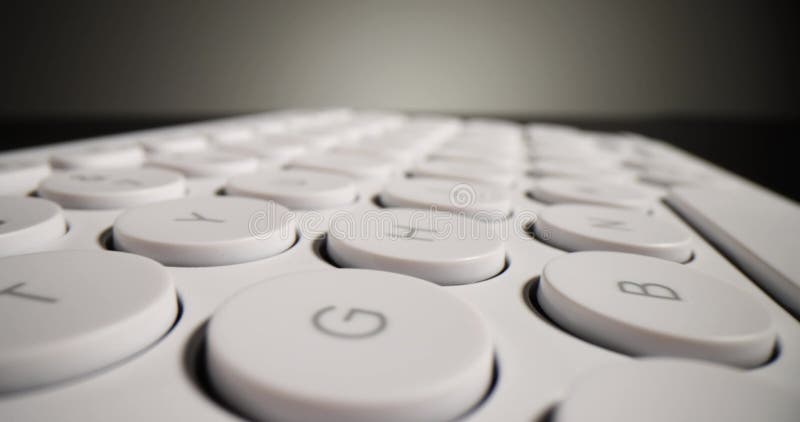 Light Modern Keyboard with Round Keys on Black Surface Stock Footage ...