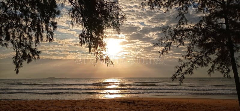 The Light of the Morning Sun Rises on the Beach. Stock Image - Image of ...