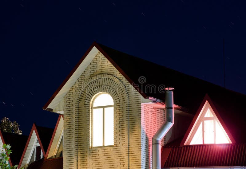 Light at the Night Arched Window on the Top Floor, the Pink Light of ...