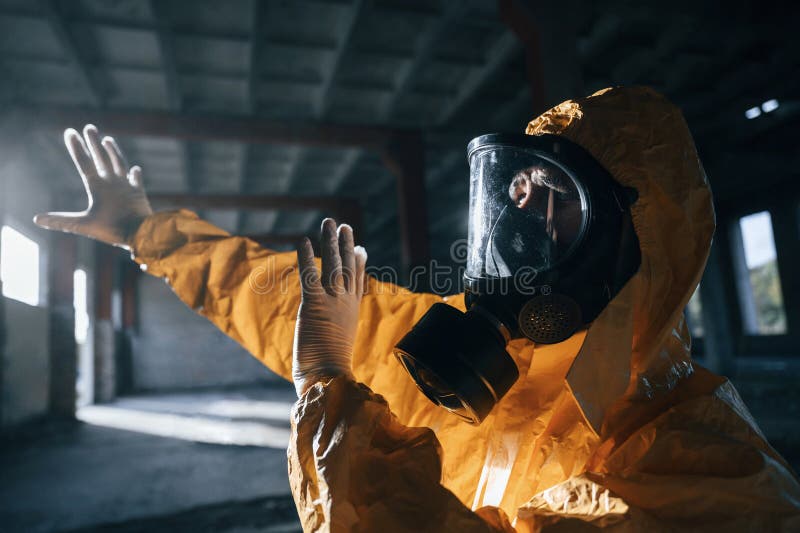 Light from Nuclear Explosion. Man Dressed in Chemical Protection Suit ...