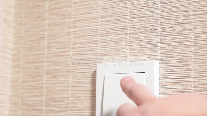 Hand Switch on Light in Kitchen Room. Special Device Connects Power ...