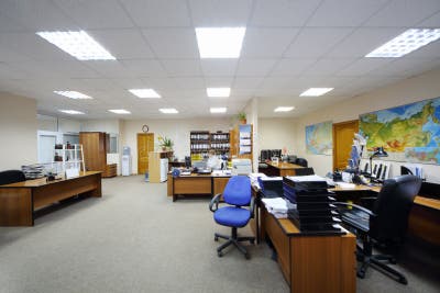 Light Office with Work Desks, Computers and Map. Stock Photo - Image of ...