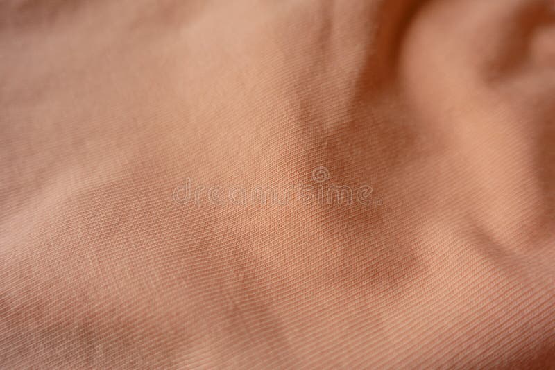 Light Orange Cotton Jersey Fabric with Soft Folds Stock Photo - Image ...