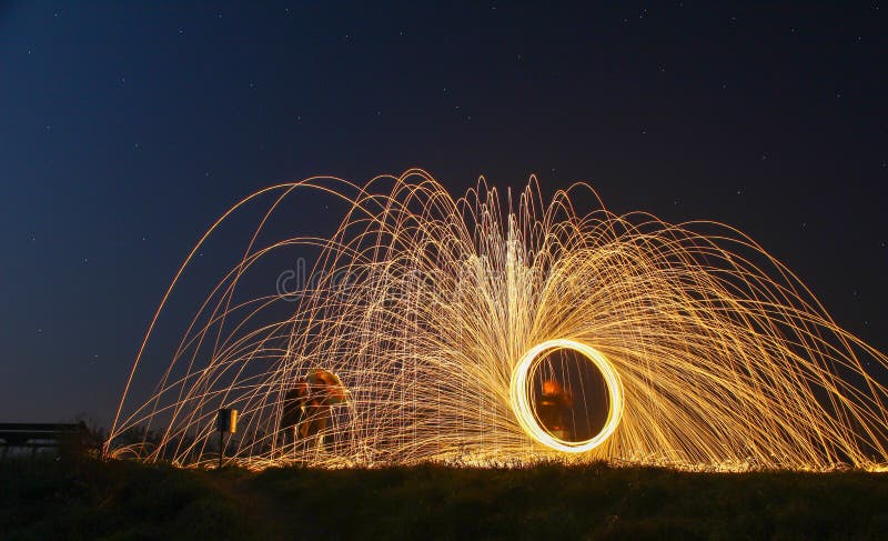 Light Painting with Fire Circles and Umbrella Stock Image - Image of ...