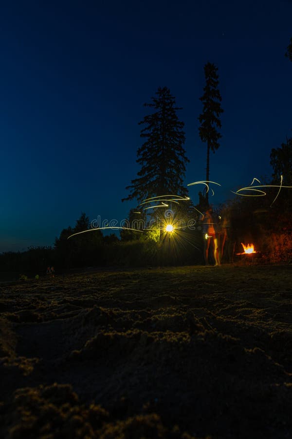 Light Painting at Night with a Flashlight on the Beach Stock Photo ...