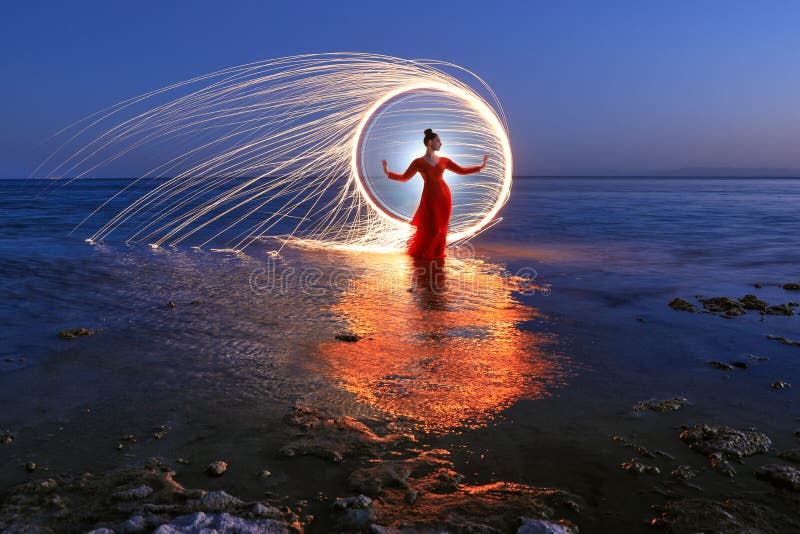 Light Painting in the Water with Fire Stock Image - Image of people ...
