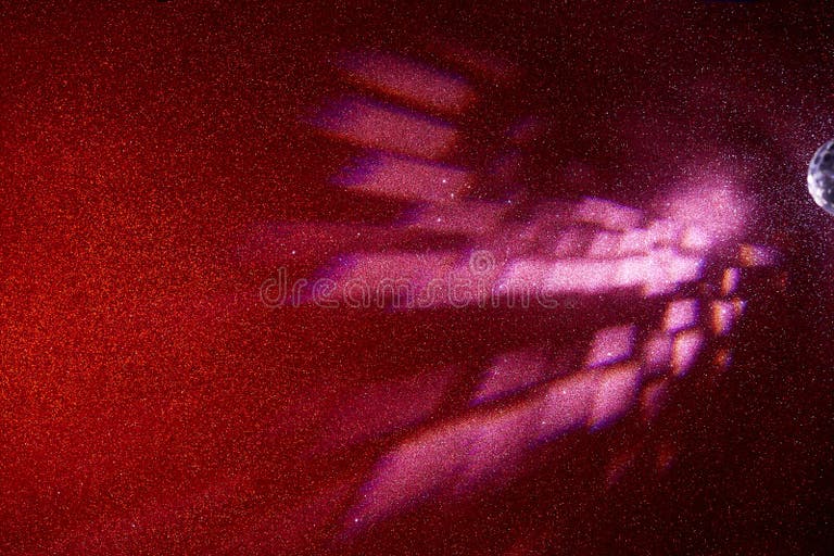 Light Pink Beams of Light on a Gradient Red Finely Grained Background ...