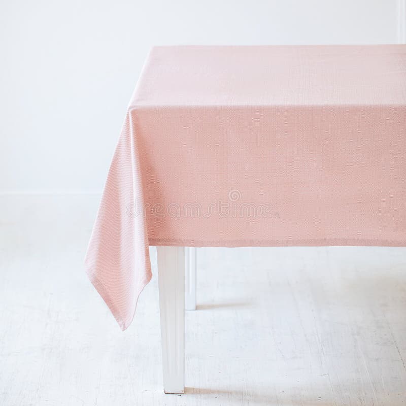 Light Pink Decorative Tablecloth on a Table on a White Background Stock ...