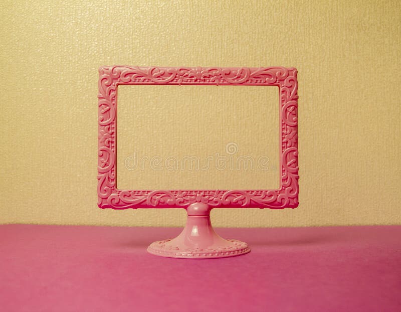 Light Pink Photo Frame on a Stand on a Yellow Background Stock Photo ...
