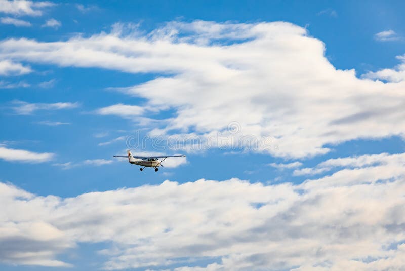 Light Plane Flying in the Cloudy Sky. Small Airplane in the Sky ...