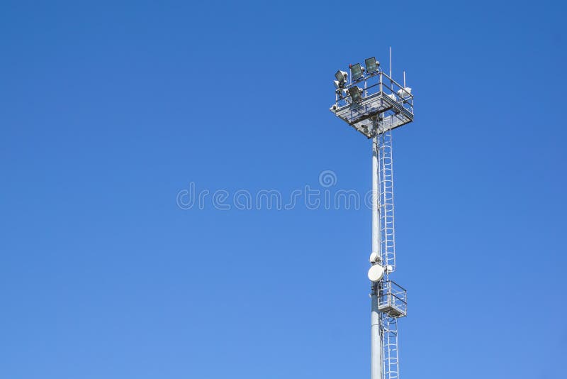Spotlight Tower Against Blue Sky. Street Lamp. Modern Light Pole Stock ...