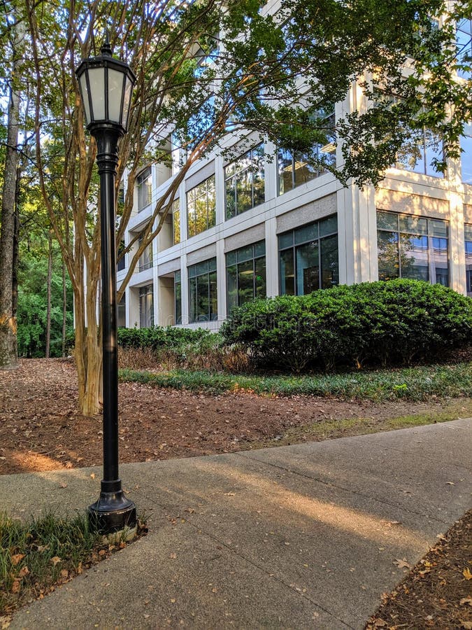 Light Pole on Walkway Next To Corporate Office Stock Photo - Image of ...