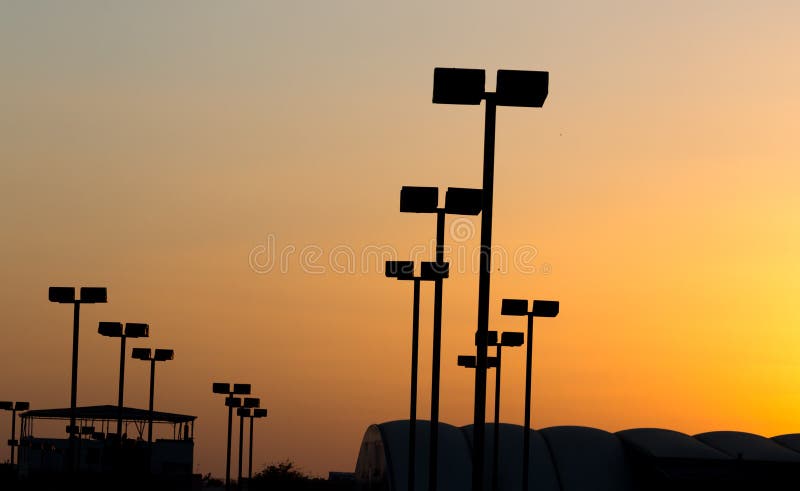 Light poles at sunset stock image. Image of high, electricity - 111932759
