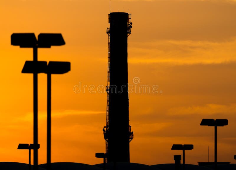 Light poles at sunset stock image. Image of industry - 111933327