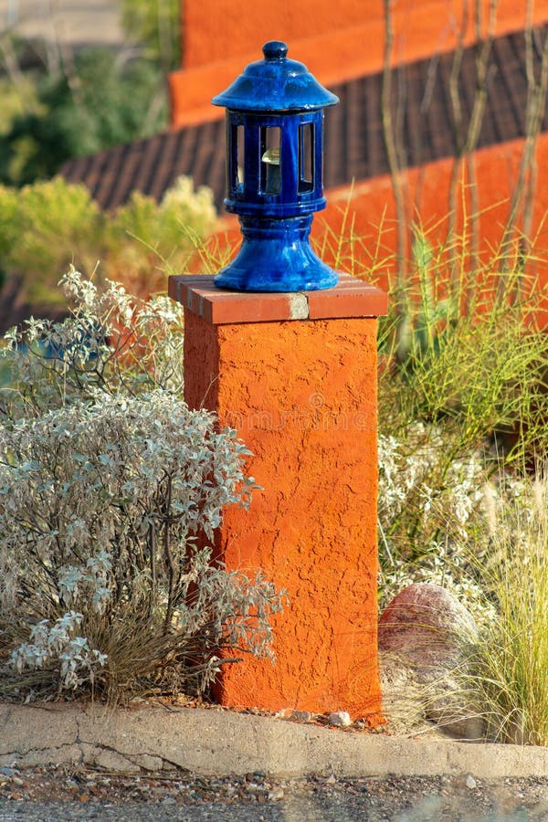 Light Post in Front Yard with Orange Stucco Exterior and Slick Blue ...