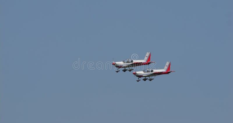 Close Formation Flight of Light Propeller Aircraft on Sunny Day Stock ...