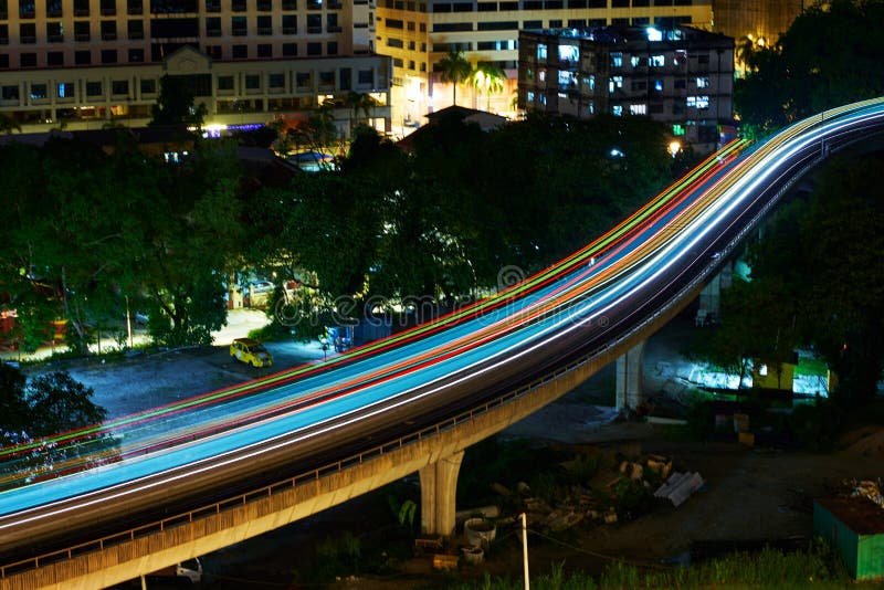 Light Rail Transit Train Moving through the City in the Night Stock ...