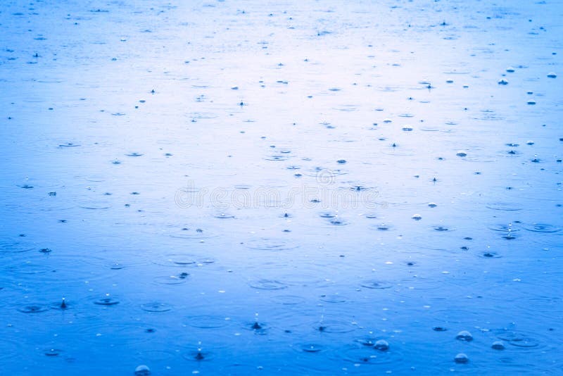 Light Rain on the Surface of on a River Water Making Circular Patterns ...