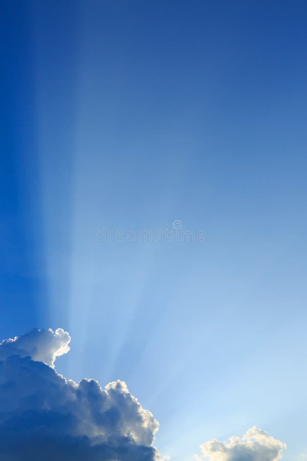 Sun Rays through Cloud Above Clear Blue Sky Stock Image - Image of ...