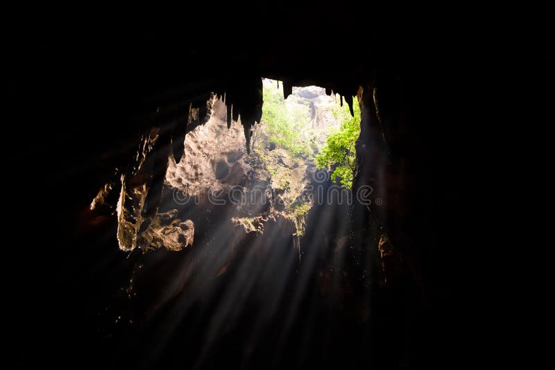 Light rays inside the cave stock photo. Image of underground - 84396734