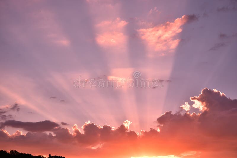 Light Rays Reflecting Off a Cloud Against a Blue Sky Stock Image ...