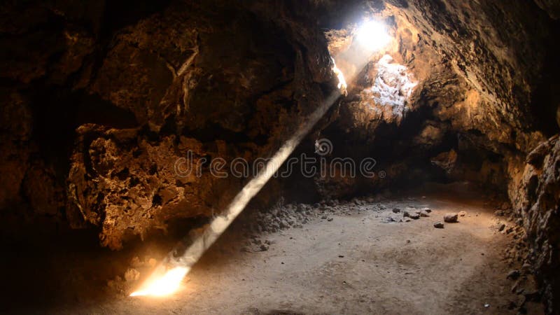 Light Rays Shine Inside of Lava Tube Cave Stock Footage - Video of ...