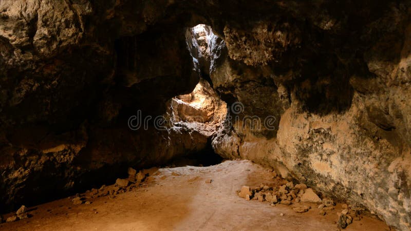 Light Rays Shine Inside of Lava Tube Cave Stock Video - Video of rocks ...
