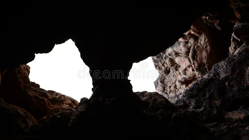 Light Rays Shine Inside of Lava Tube Cave Stock Video - Video of rocks ...