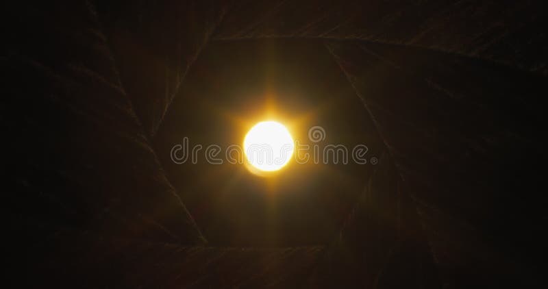 Light Rays Shining through Old Camera Lens, while Diaphragm Blades are ...