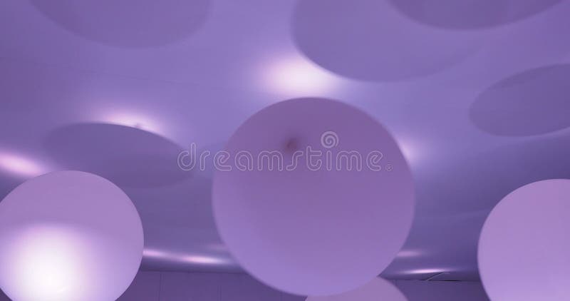 Light Reflecting on Violet Ceiling with Balloons Stock Footage - Video ...