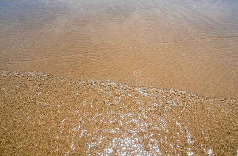 Light Reflection on Surface of Movement Sea on Sand Beach Stock Image ...