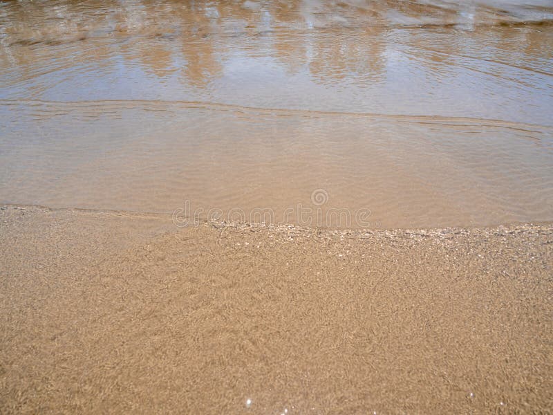 Light Reflection on Surface of Movement Sea on Sand Beach Stock Photo ...