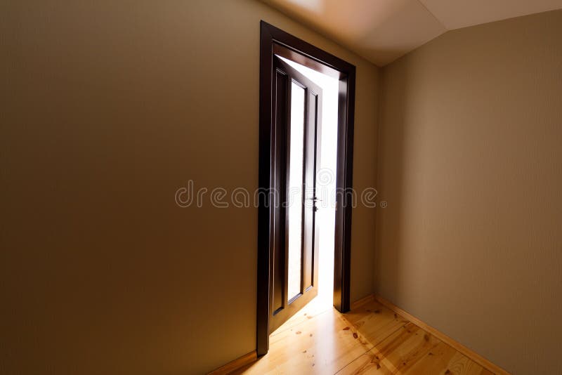 The Light Revealing through the Half Open Door in the House Stock Photo ...