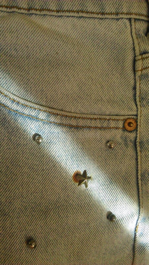 Light on Rusty Stars on Old Jeans Stock Image - Image of rusty, jeans ...