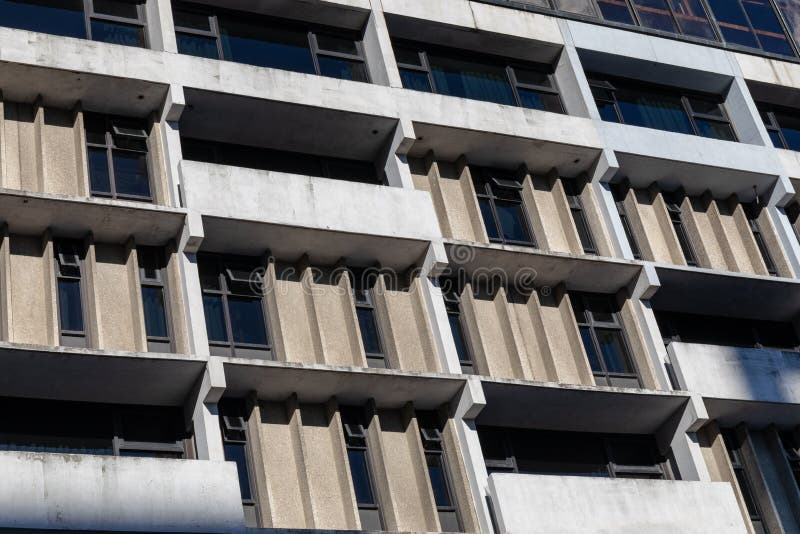 Light and Shadow on a Brutalist Concrete Apartment Building Stock Photo ...