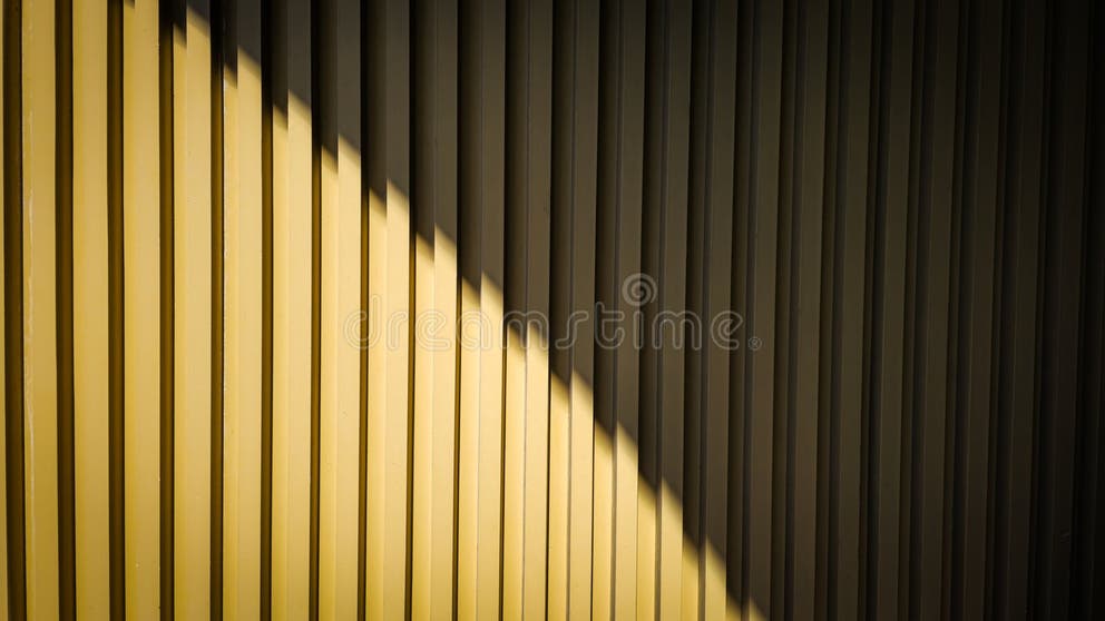 Light and Shadow Create Geometric Shapes and Divide the Wall into Two ...