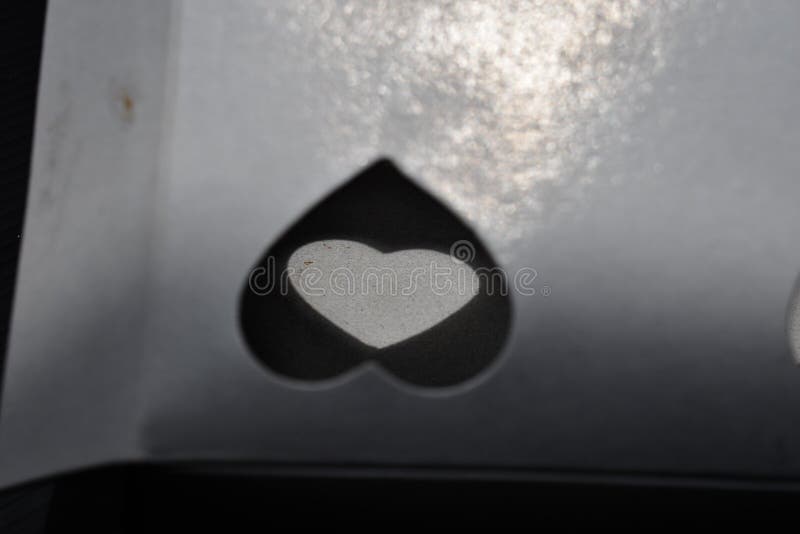 Light and Shadow with Heart Symbol on White Box on the Black Background ...