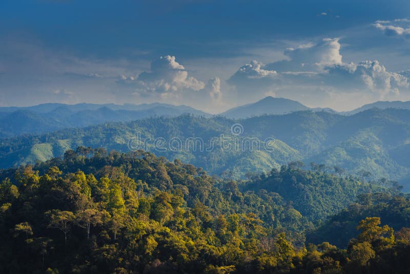 Light and Shadow on Mountain Range with Clouds and Sky Stock Photo ...