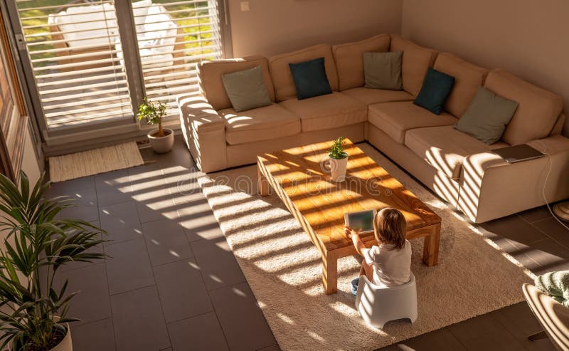 Hard Light Portrait Of Cute Tween Girl Lying On Sofa With Book Looking At Camera With Funny