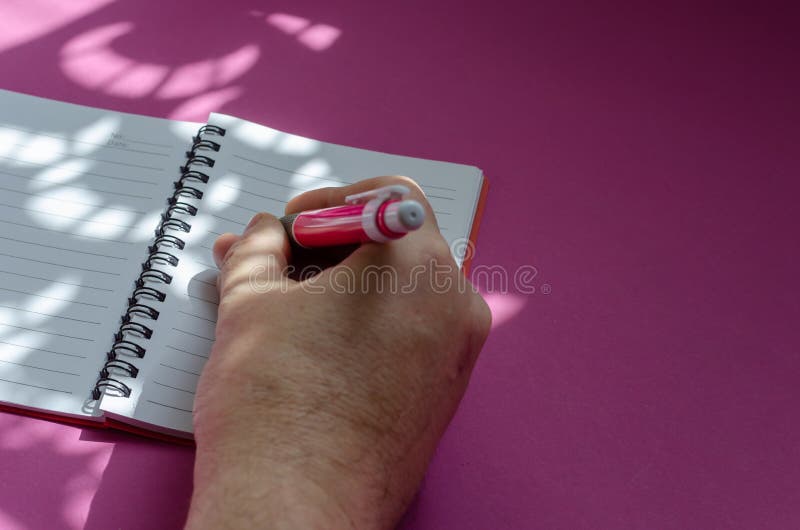 A Light and Shadowy Composition of a Right Hand Writing in a Not Stock ...